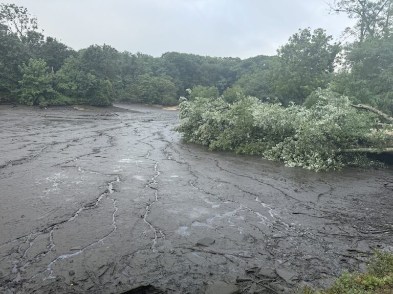 Photos: Flash flood collapses road, empties duck pond in Stony Brook