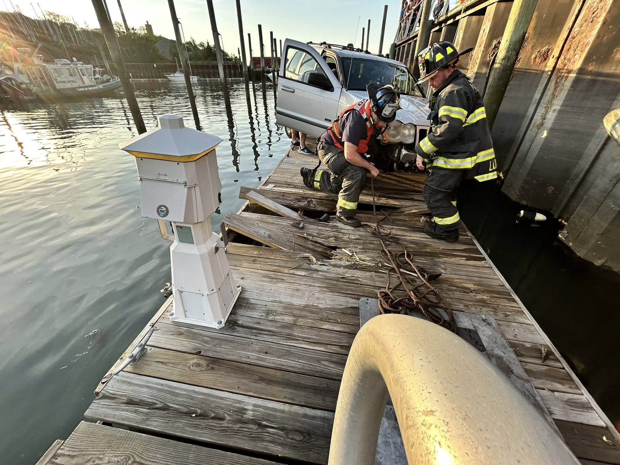 Watch: SUV flies off Port Jeff marina dock; sticks miracle landing